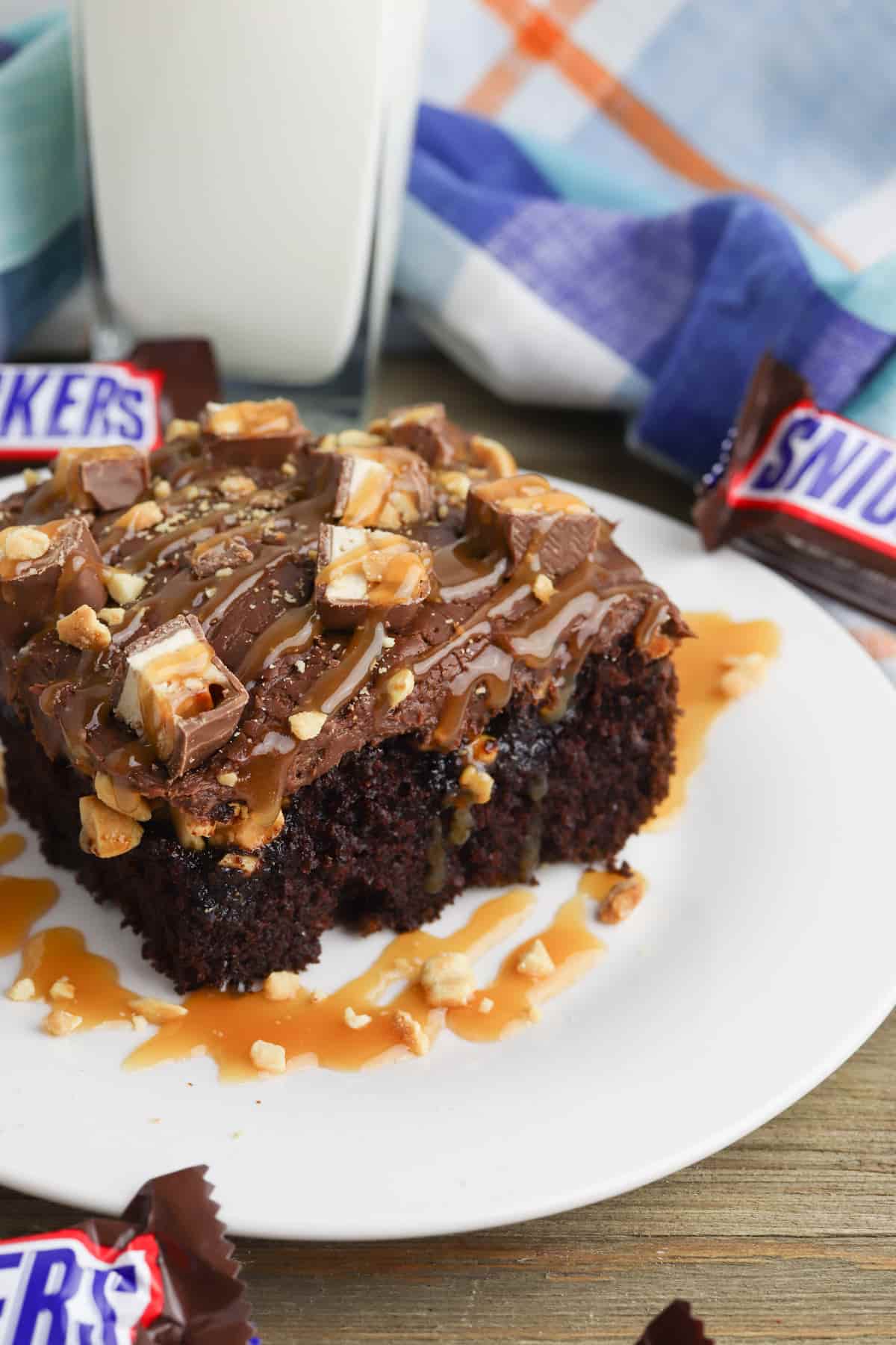 Easy Snickers Poke Cake - Nine Recipes